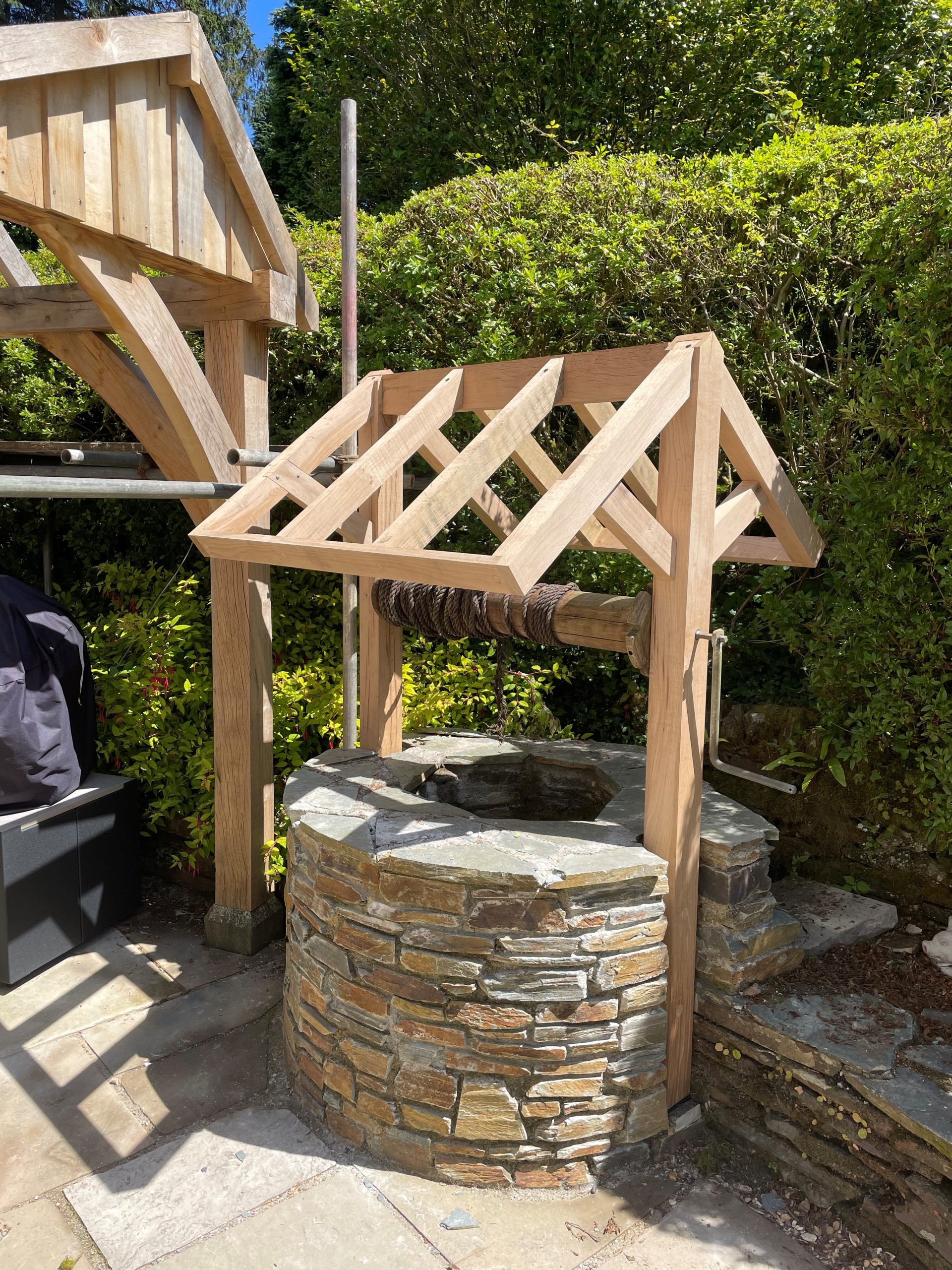 a green oak timber framed wishing well cover | Tamar Joinery Company